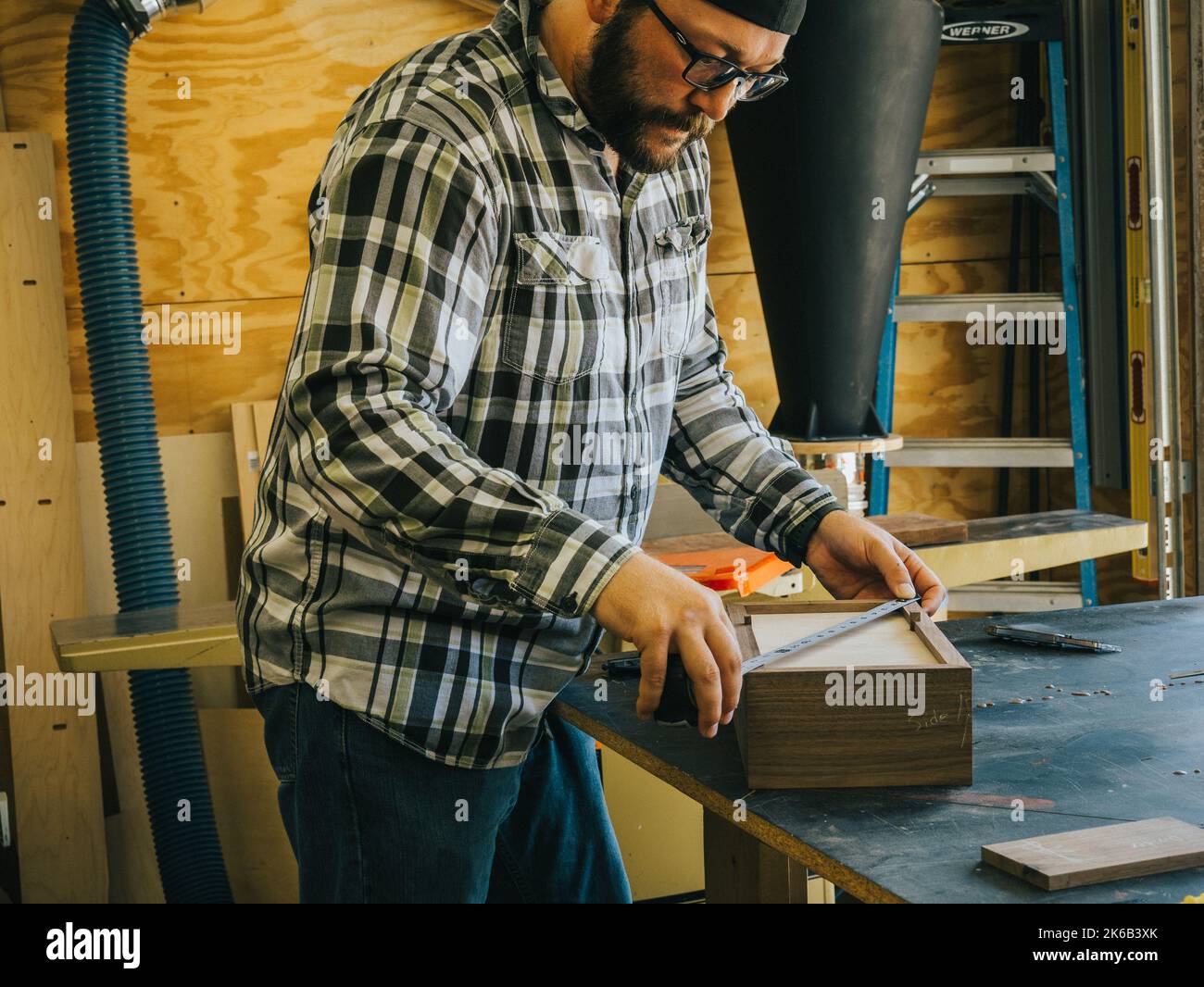 A carpenter building a box in his woodshop Stock Photo - Alamy