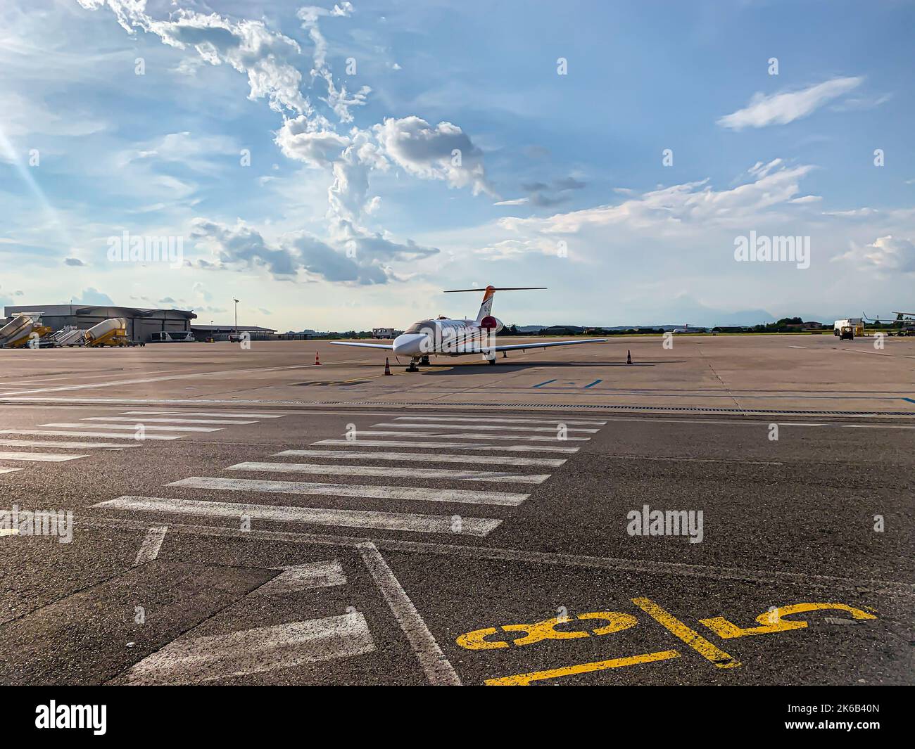 Private Jet on the tarmac of an airport Stock Photo - Alamy