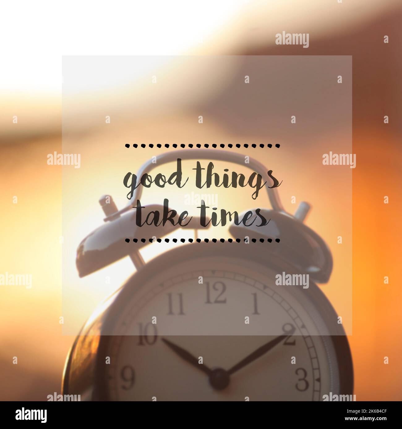Alarm clock written GOOD THINGS TAKE TIME over blur background Stock ...