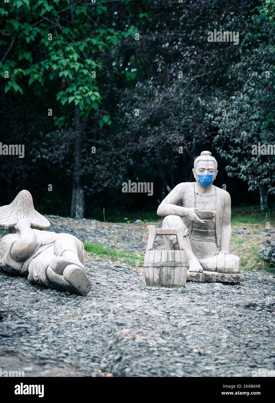 The Asian statues with a mask Stock Photo - Alamy
