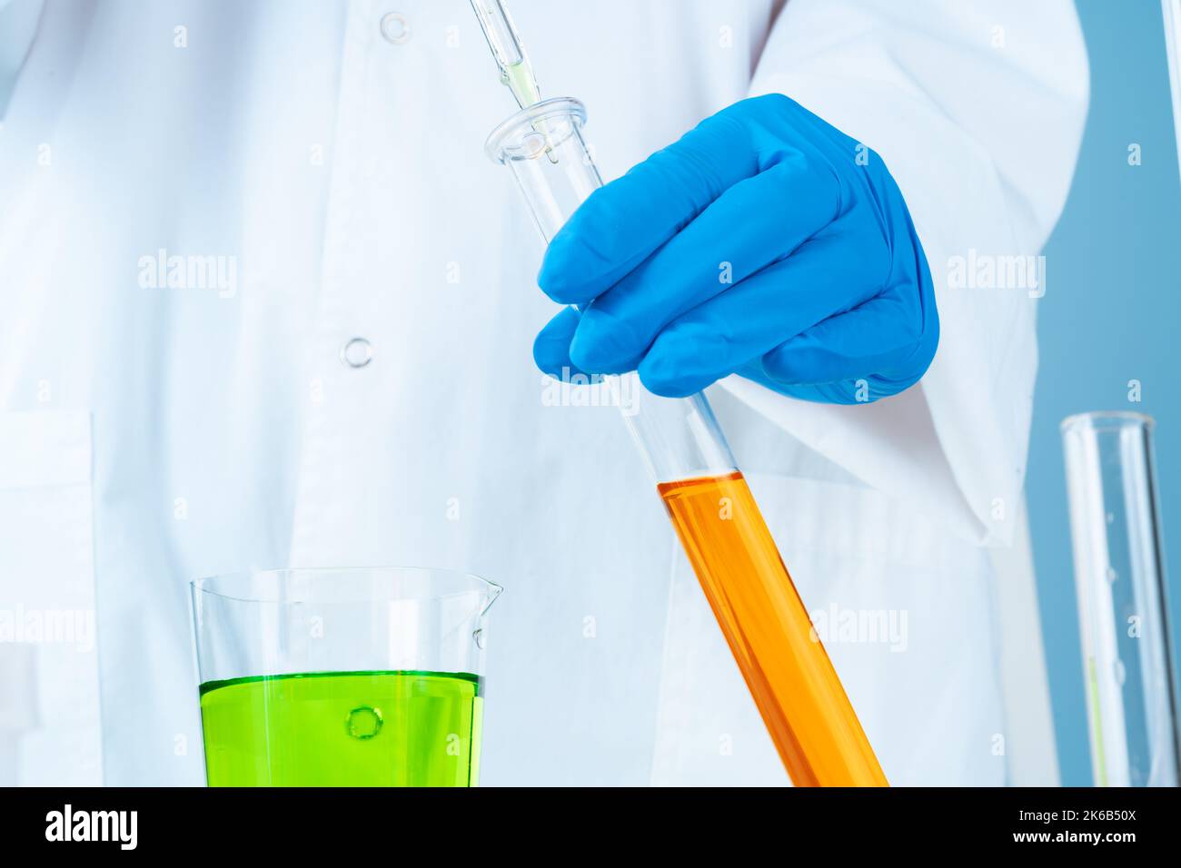 Manipulations with laboratory glass chemical containers on table Stock ...