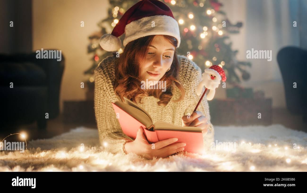 Girl writes christmas letter for Santa Claus Stock Photo - Alamy