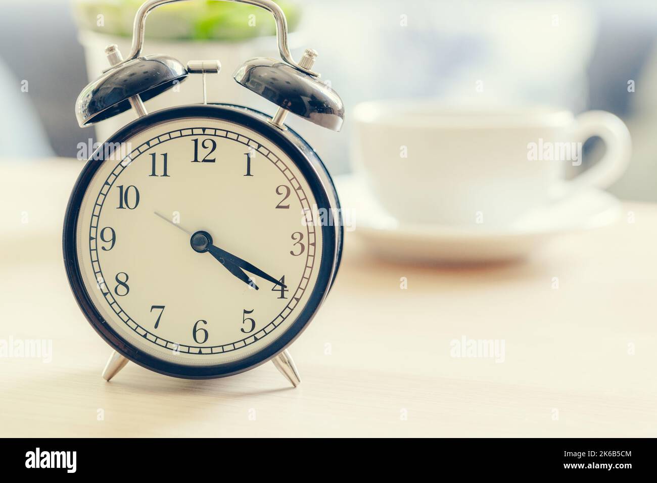 Morning sun. Alarm clock on a beautiful background Stock Photo - Alamy