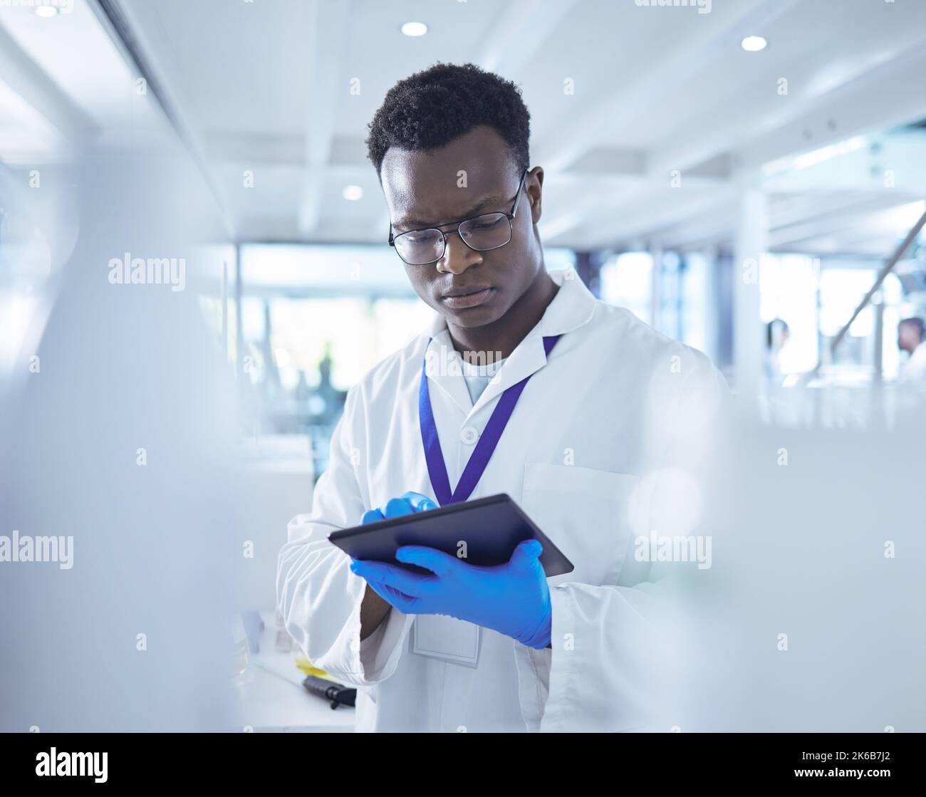 He couldnt function without his tech. a male scientist using his ...