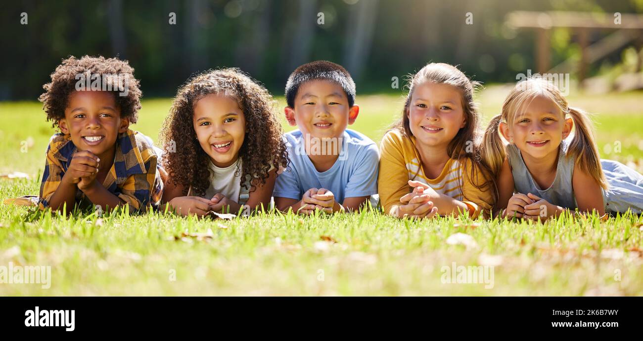 If Im not at school, Im out exploring nature. a group of kids laying on ...