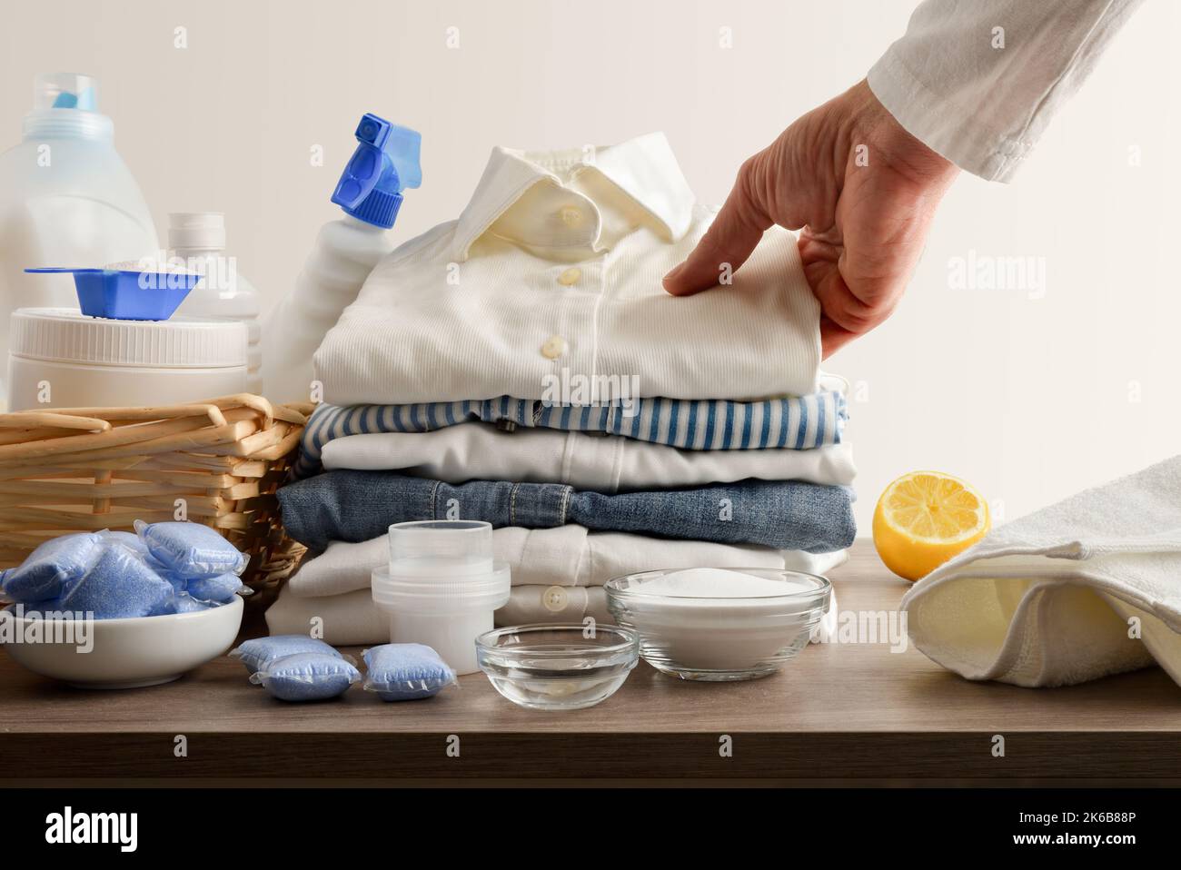 Products and person showing freshly washed clothes white isolated ...