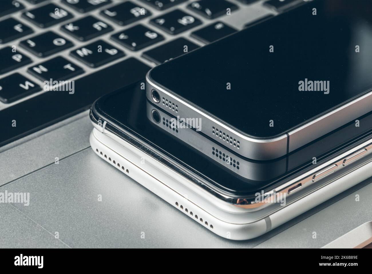 Laptop and mobile phone on the table. Workspace concept Stock Photo - Alamy