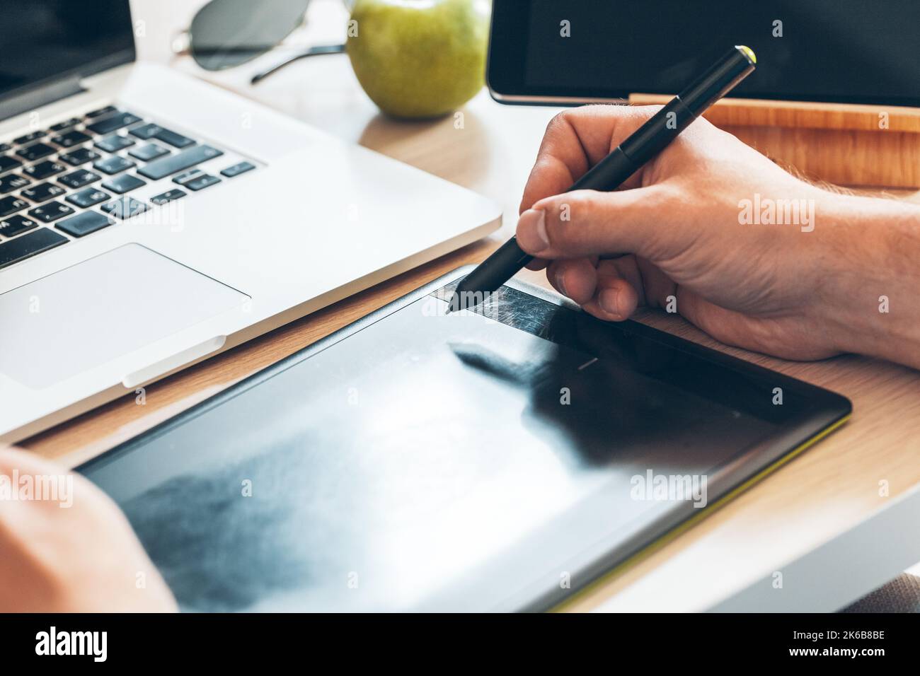 graphic designer using a pen tablet Stock Photo - Alamy