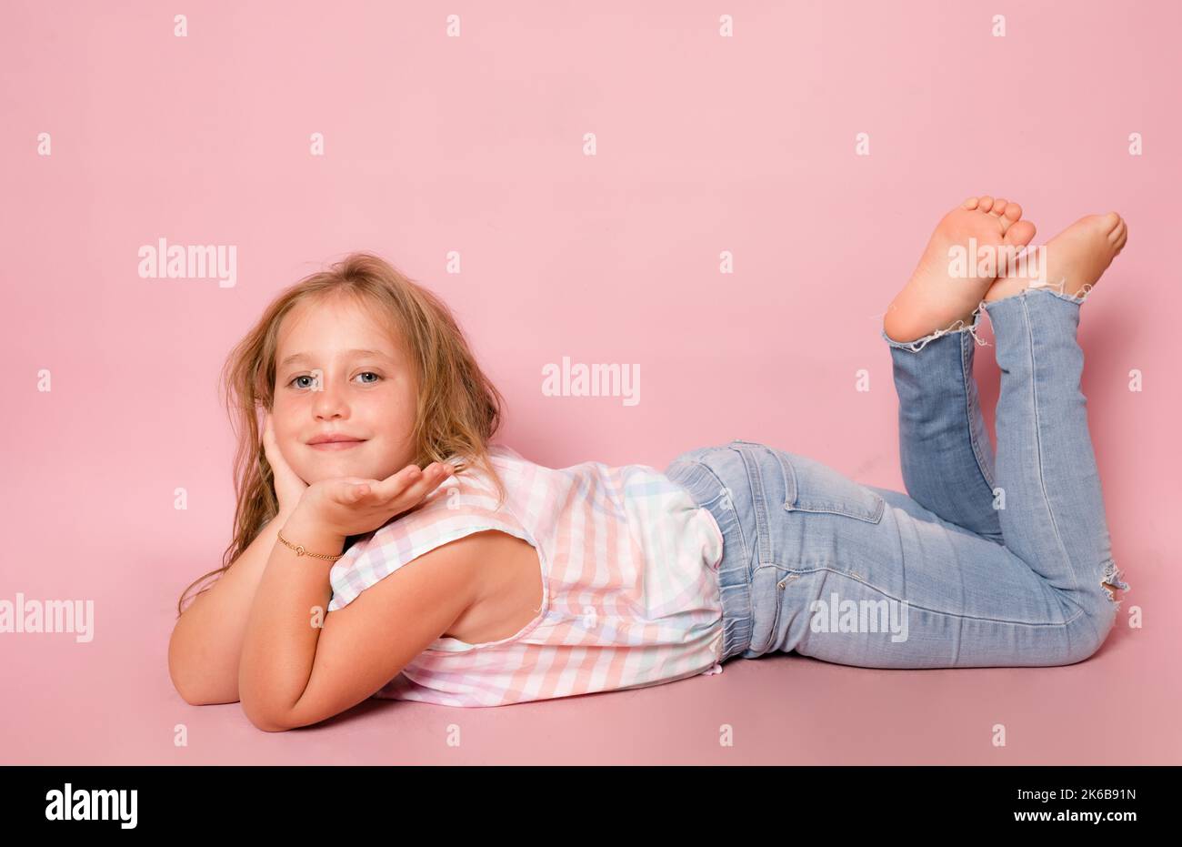 Full length photo of young cheerful girl happy positive smile lying on ...