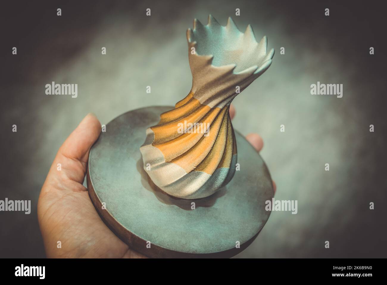Man is holding object printed on metal 3d printer. Object printed in ...