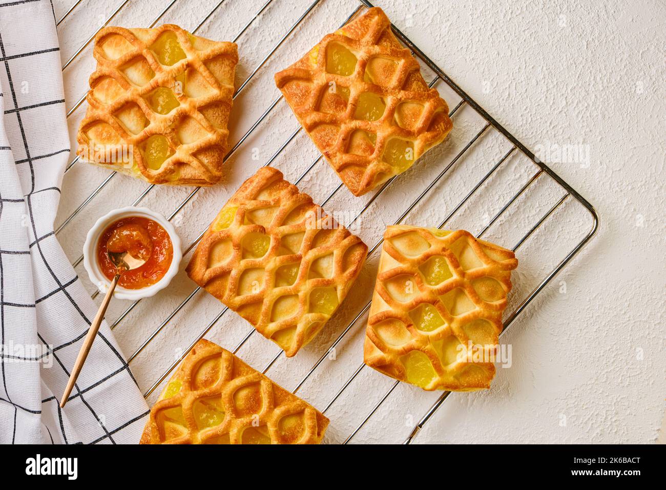puff pastry mini pies with with pear and lime jam Stock Photo - Alamy