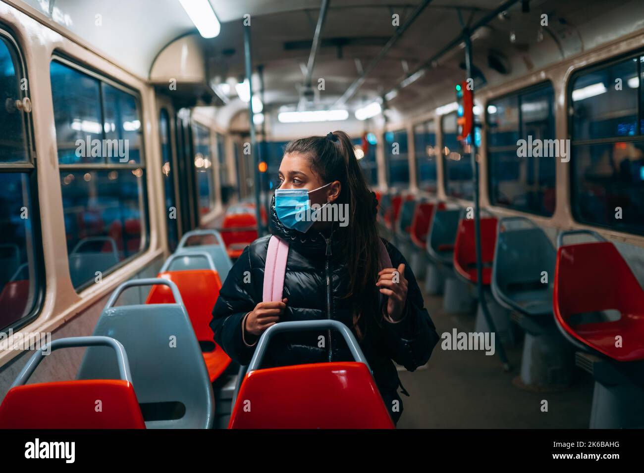 Young woman with mask traveling in the public transport Stock Photo - Alamy