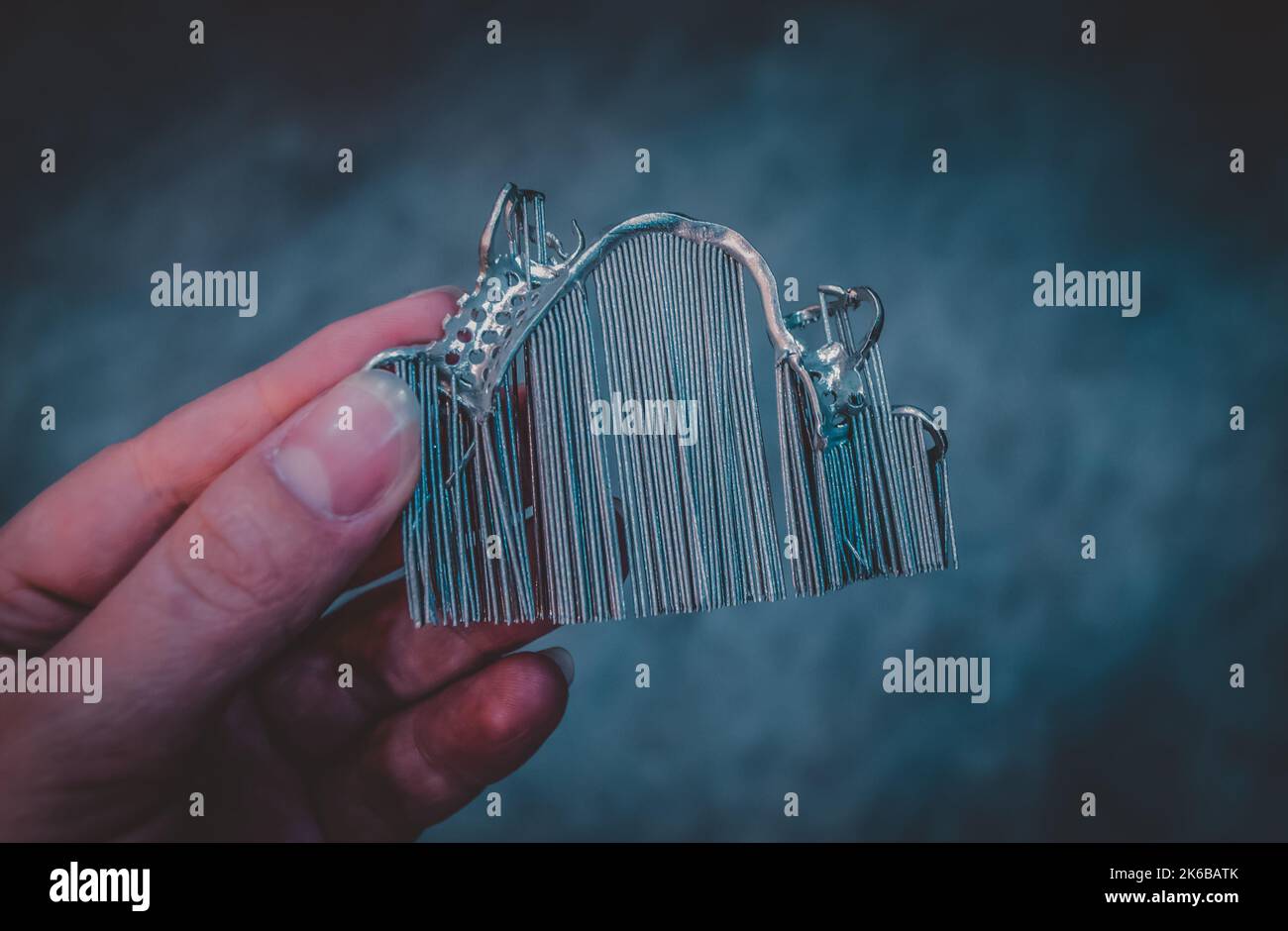 Man is holding object printed on metal 3d printer. Object printed in ...