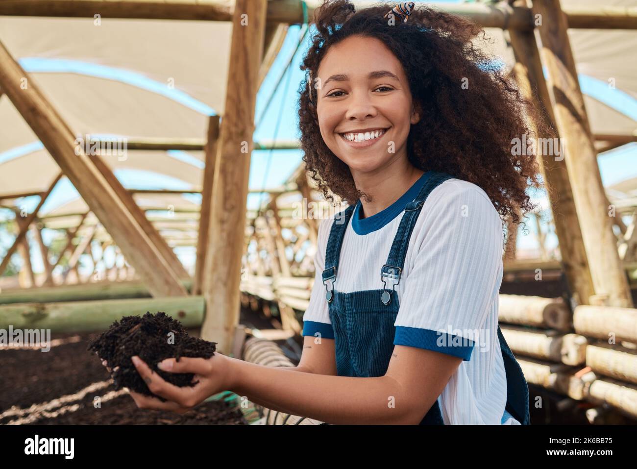 Good soil will help your crops grow tall and strong. Portrait of a ...