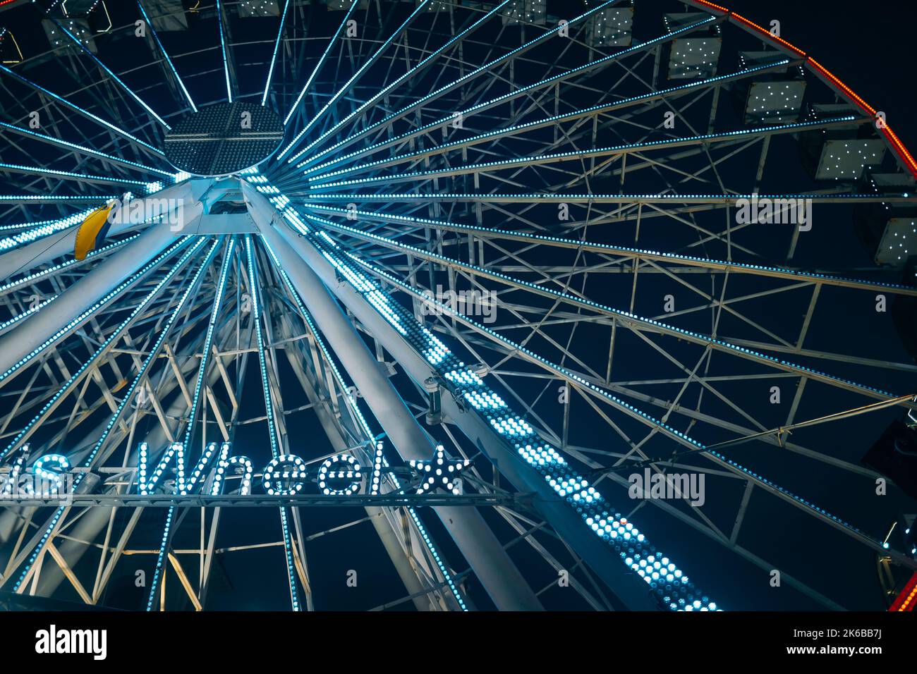 Colorful ferris wheel at night, close view Stock Photo - Alamy