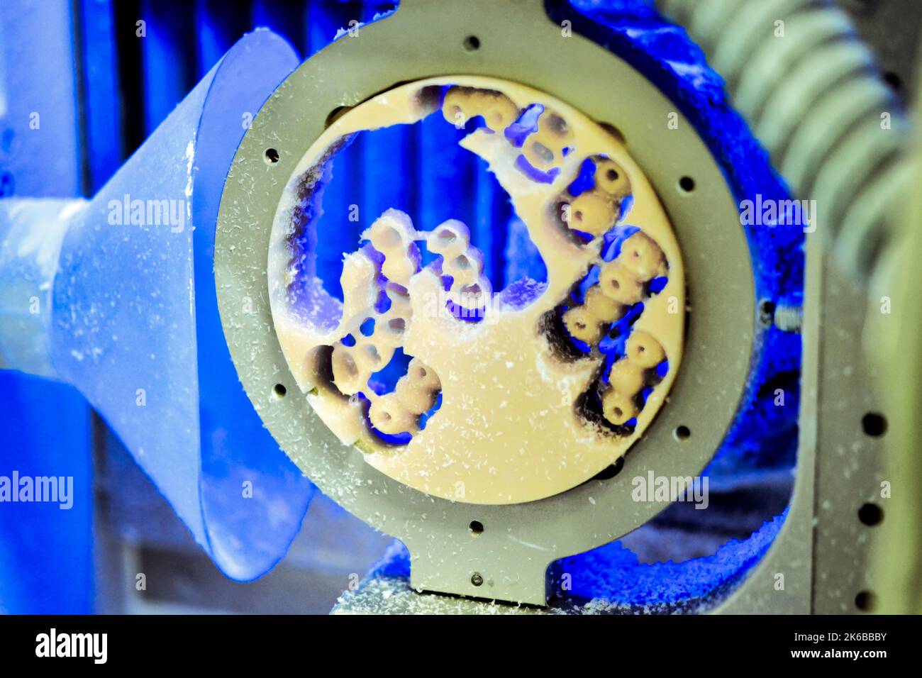 Dental milling machine carving out shape of human teeth close-up ...