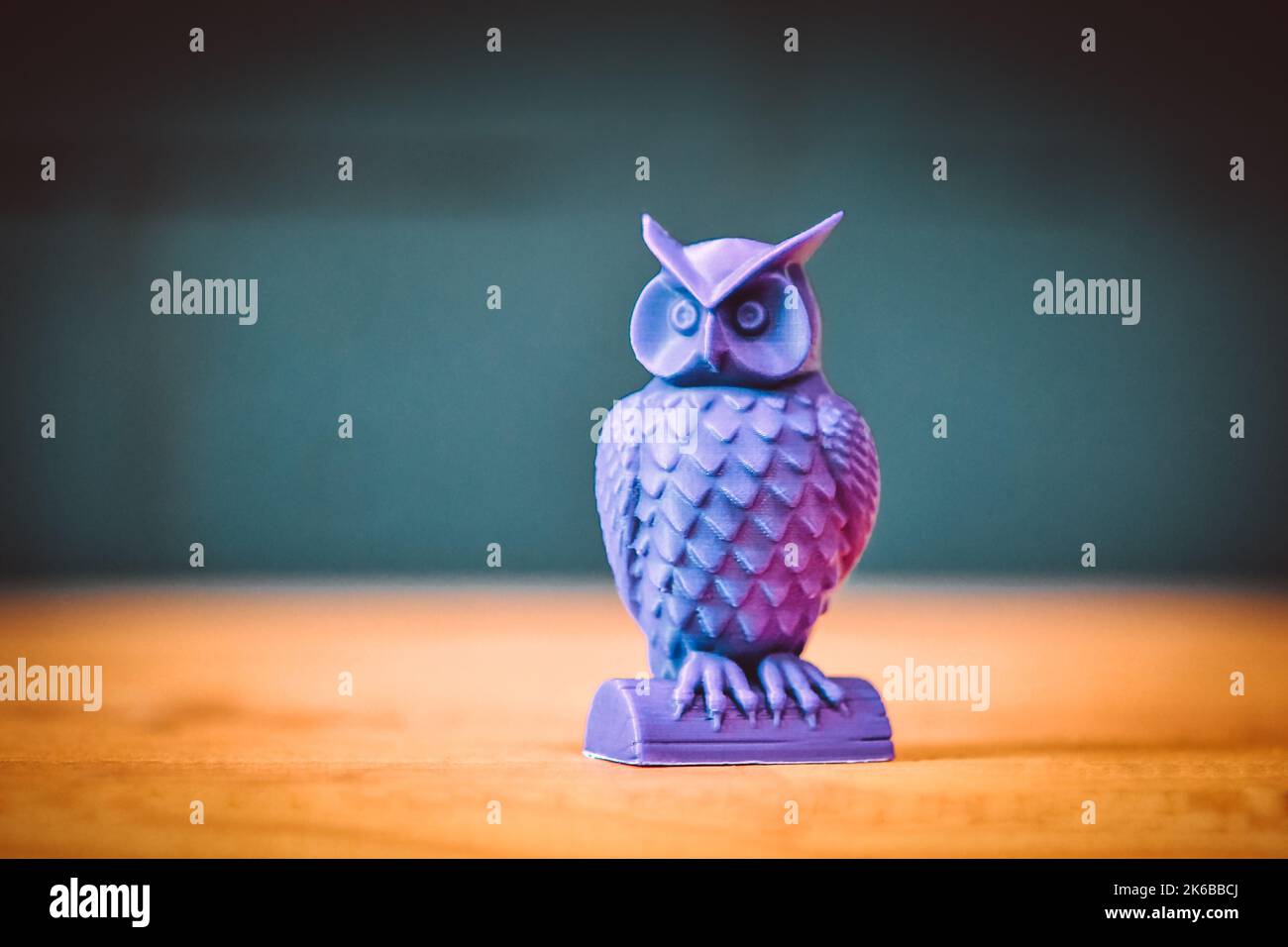 One object of purple color printed 3d printer is stands on yellow table ...
