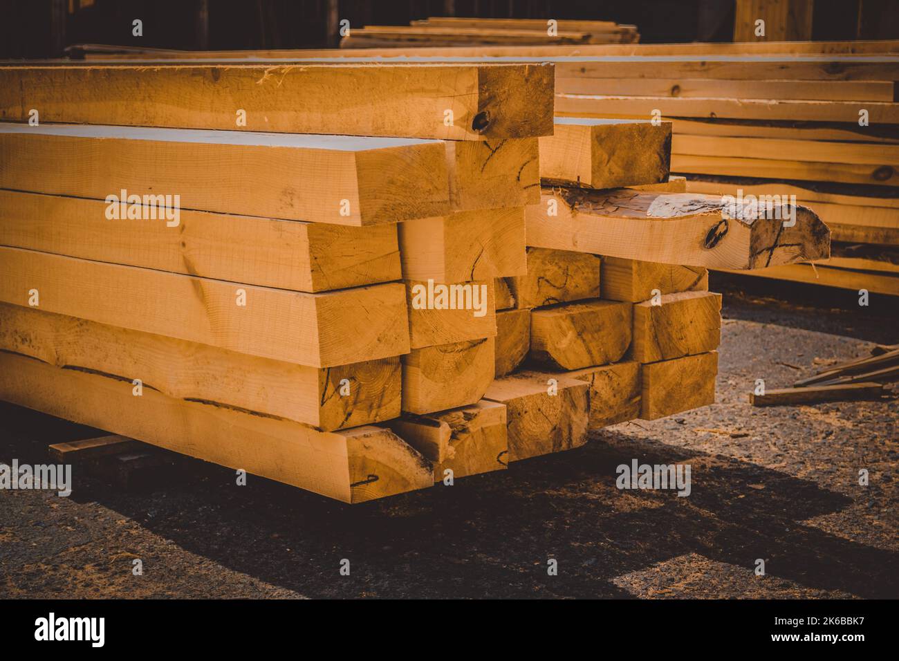Sawmill. Warehouse for sawing boards on a sawmill outdoors. Wood timber ...