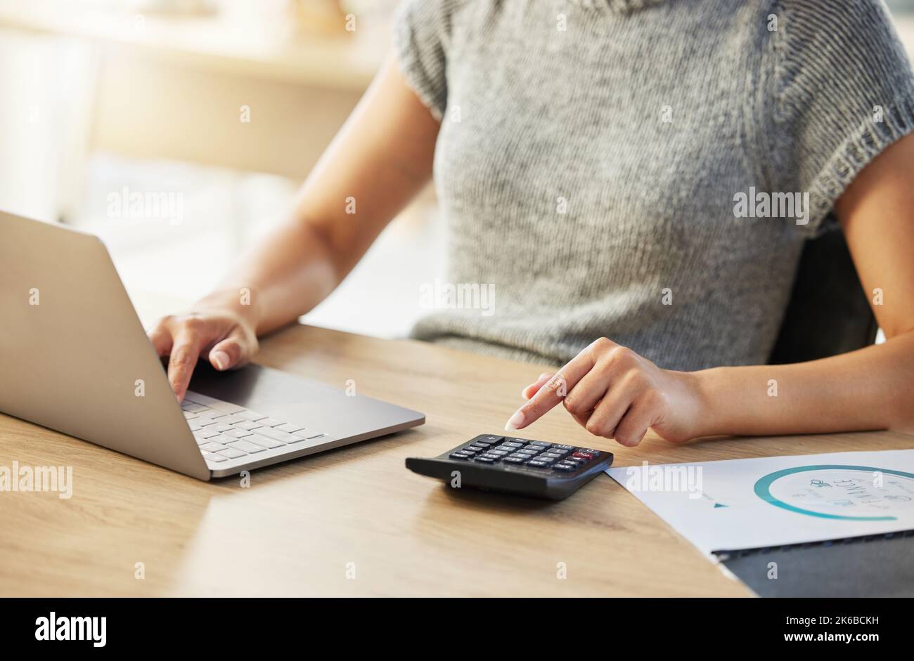 Getting her finances in order. a businesswoman working on her budget ...