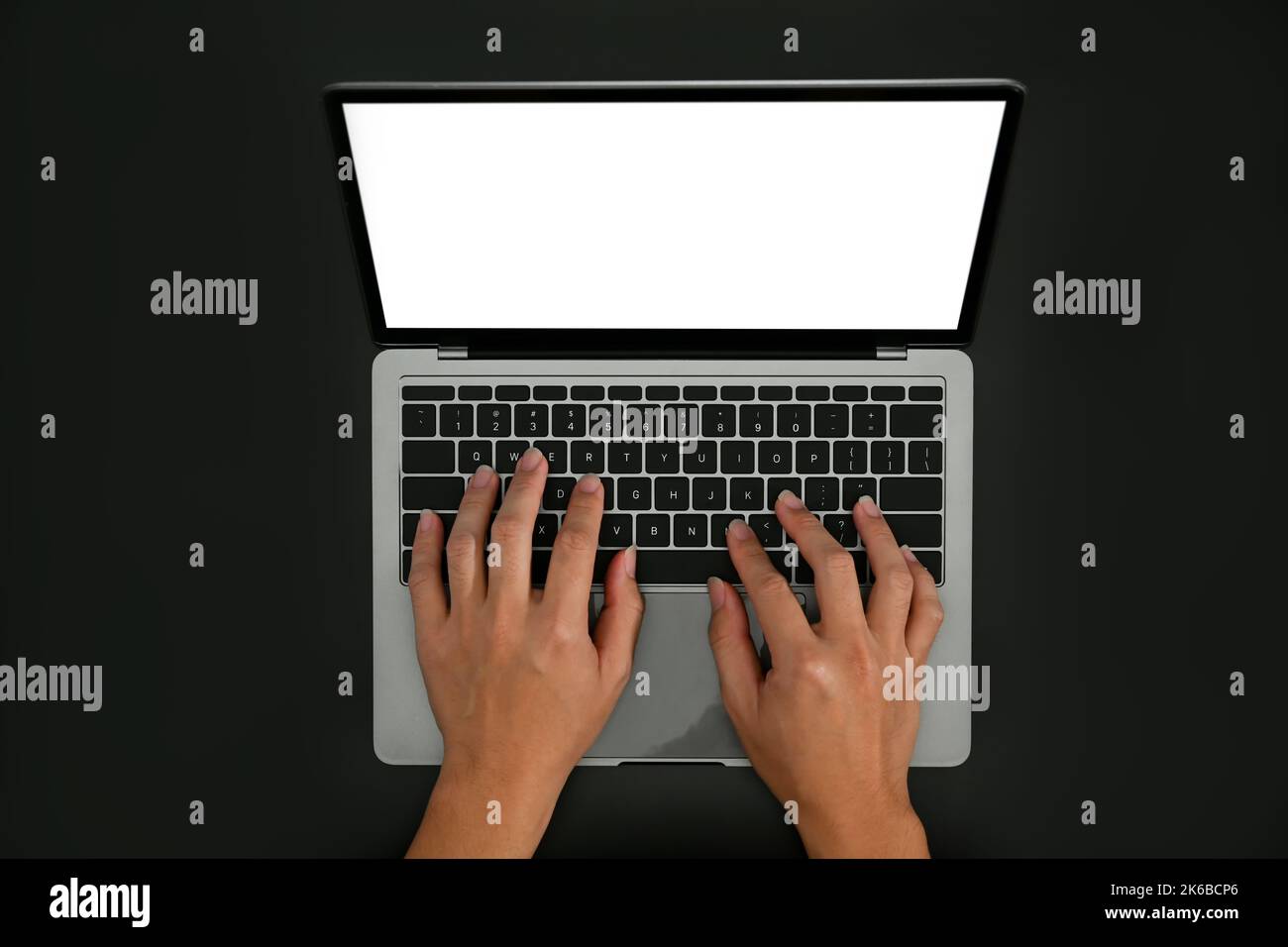 Above view woman man hands typing on laptop computer isolated in black ...