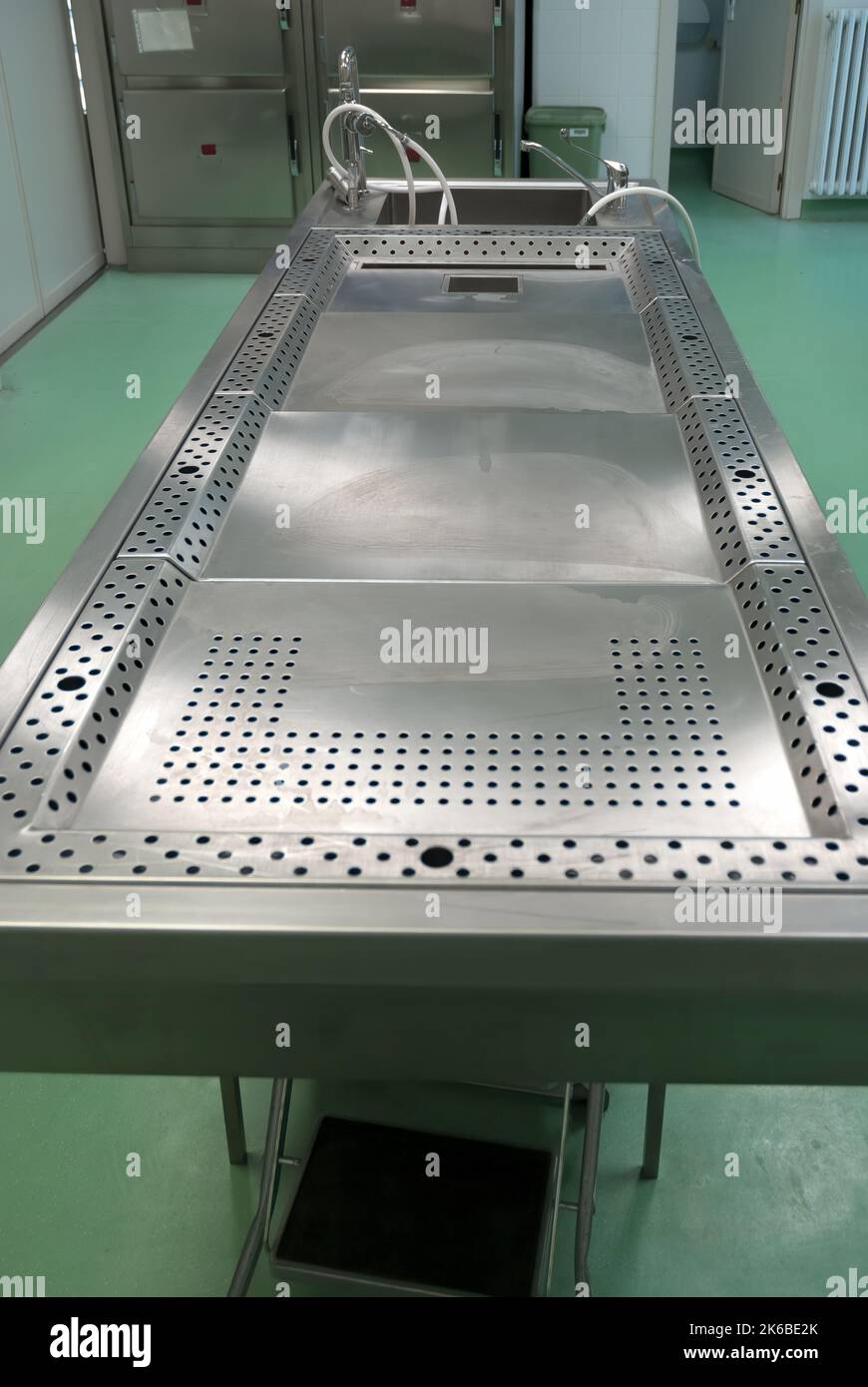 A stainless steel work table for post-mortem procedures and dissections ...