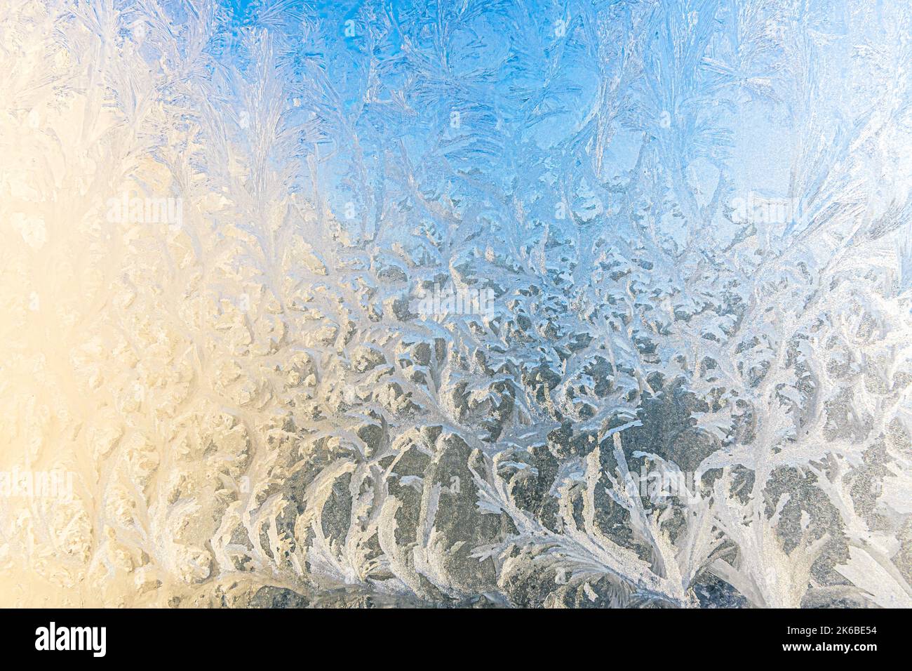 Frozen winter window with shiny ice frost pattern texture. Christmas ...