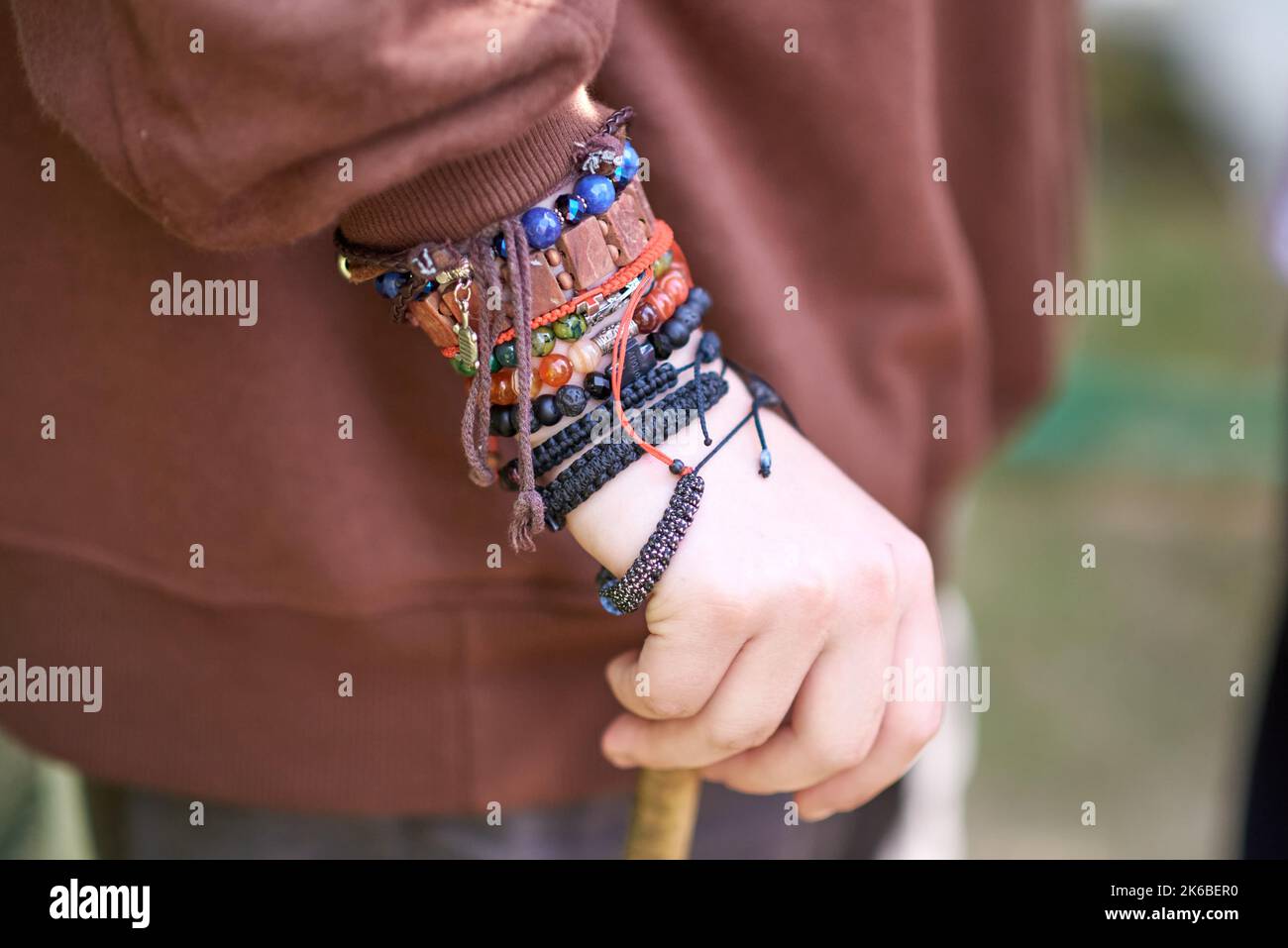 A collection of multi-colored bracelets on a woman's wrist Stock Photo ...