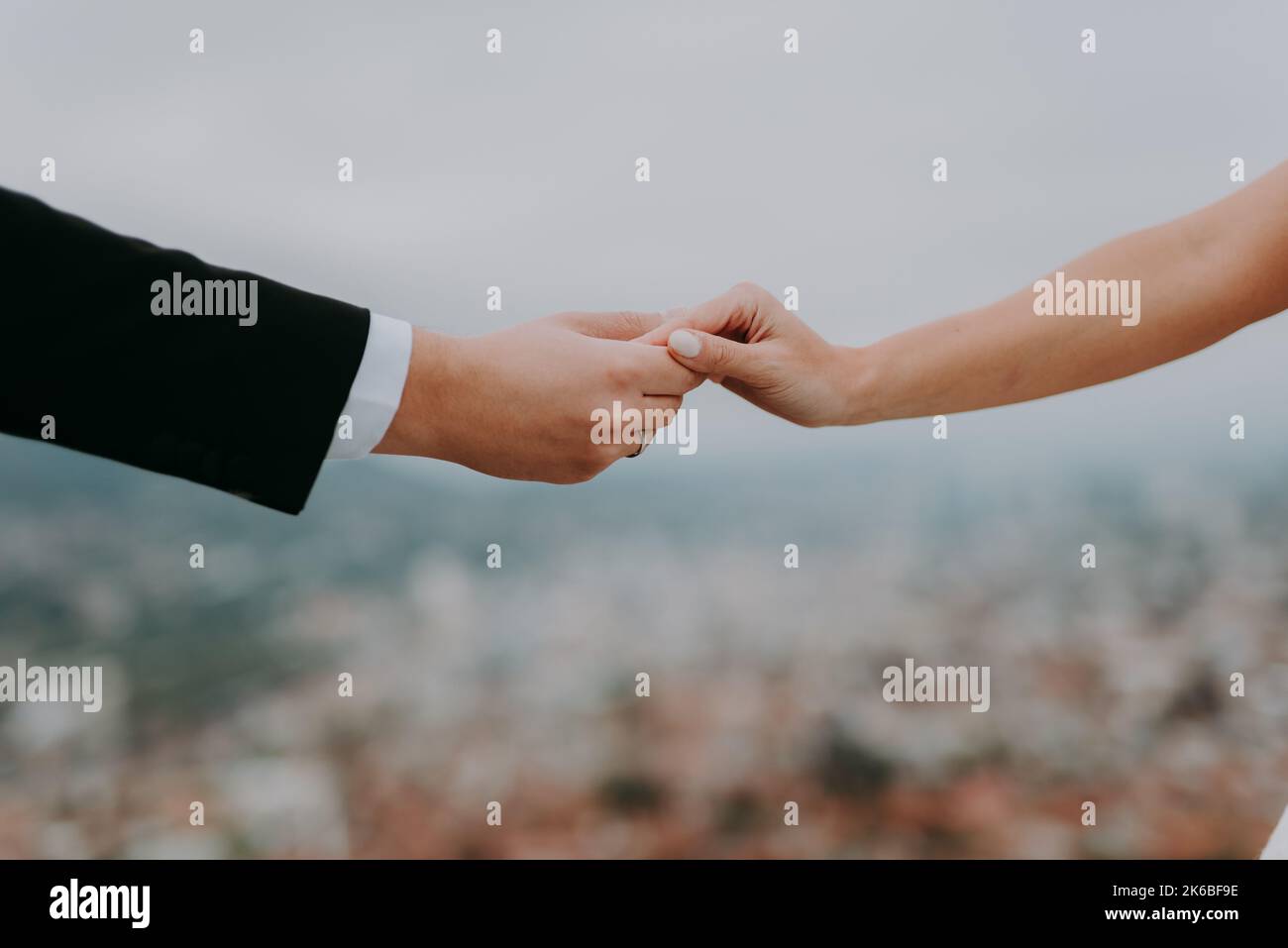 "She said yes" - Couple holding each other hands Stock Photo - Alamy