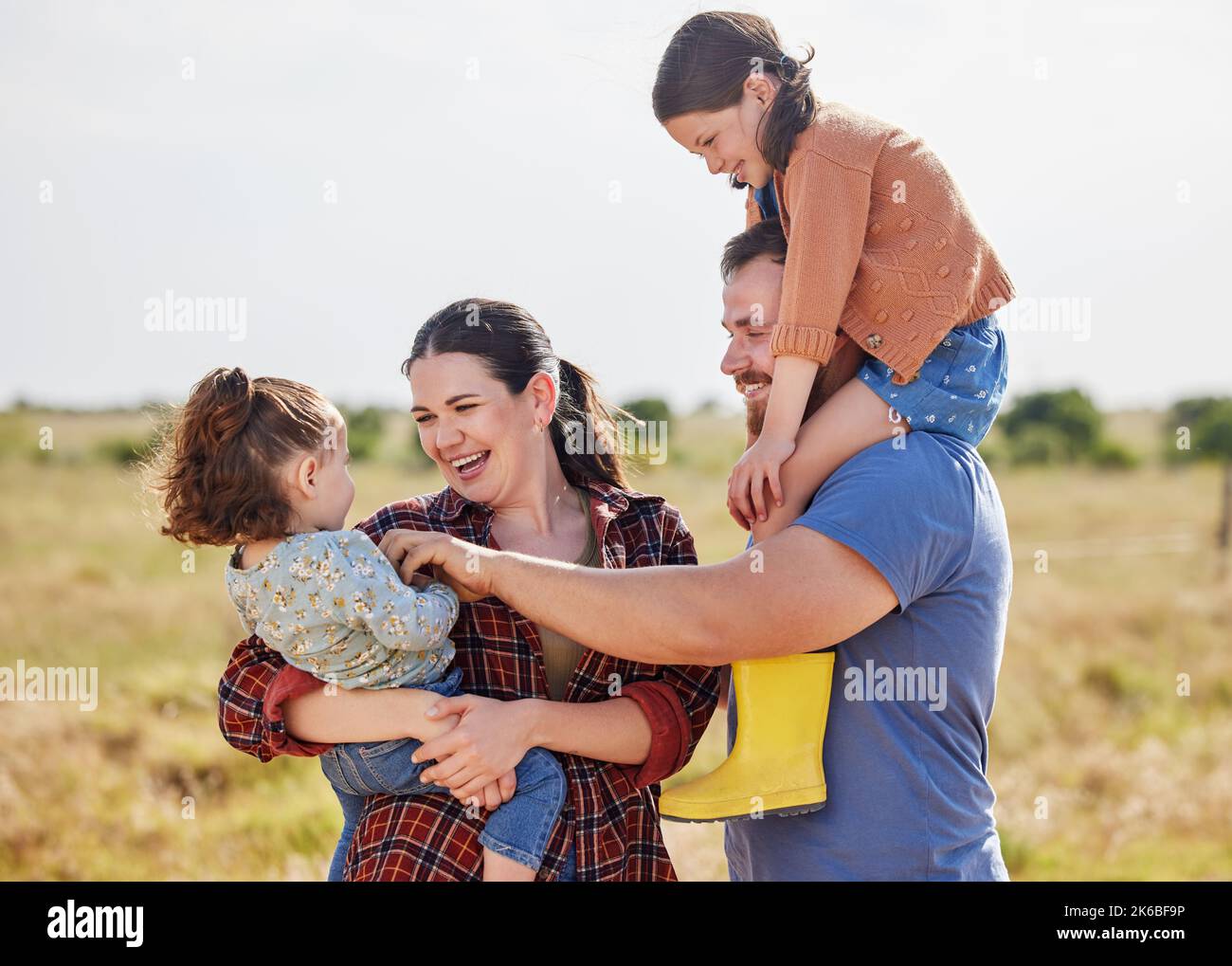 My family means the world to me. a couple on a farm with their two ...
