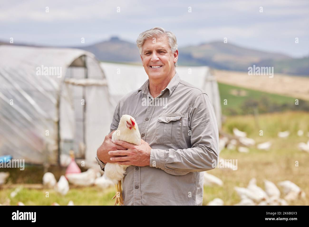 This is what farm fresh is all about. Portrait of a mature man working ...