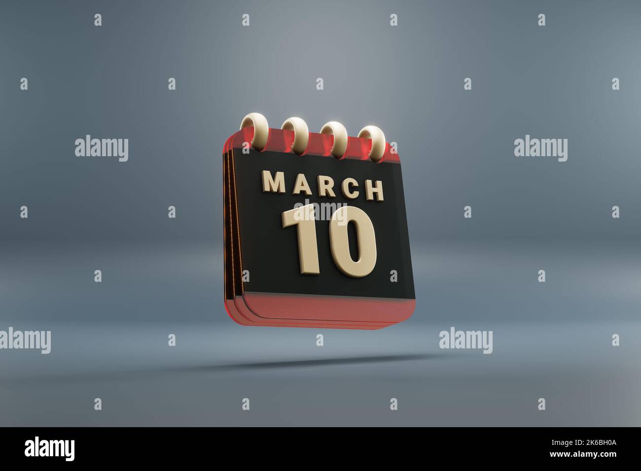 Standing black and red month lined desk calendar with date March 10 ...