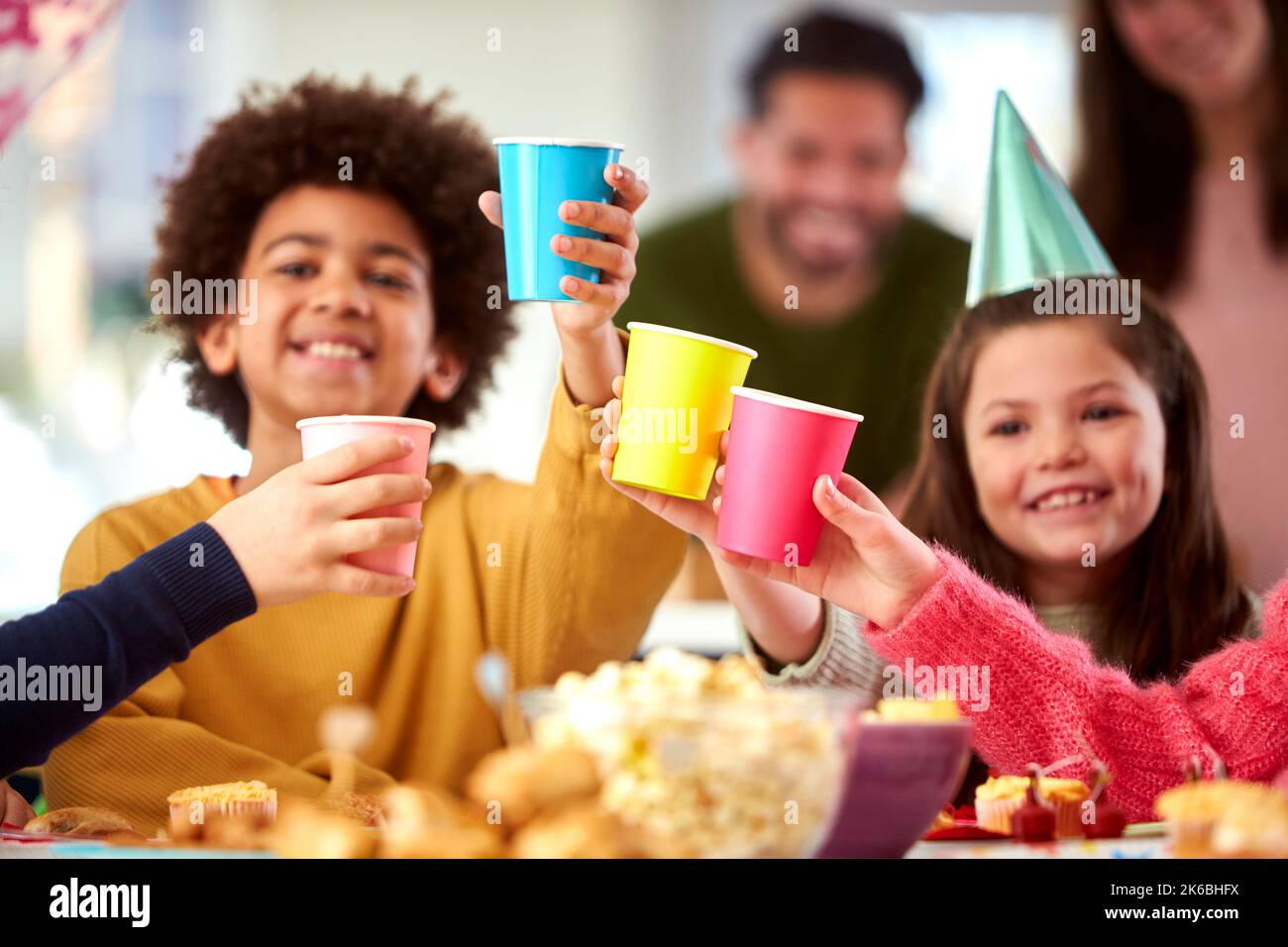 Girl parents friends home celebrating hi-res stock photography and ...