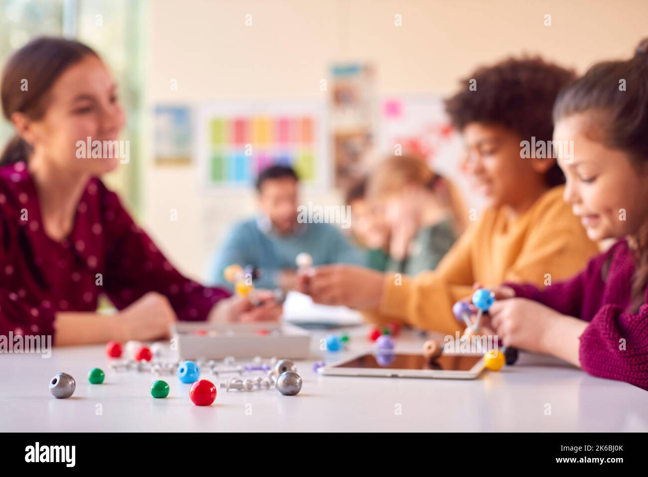 Multi-Cultural Students With Teachers In Classroom Studying Molecular ...