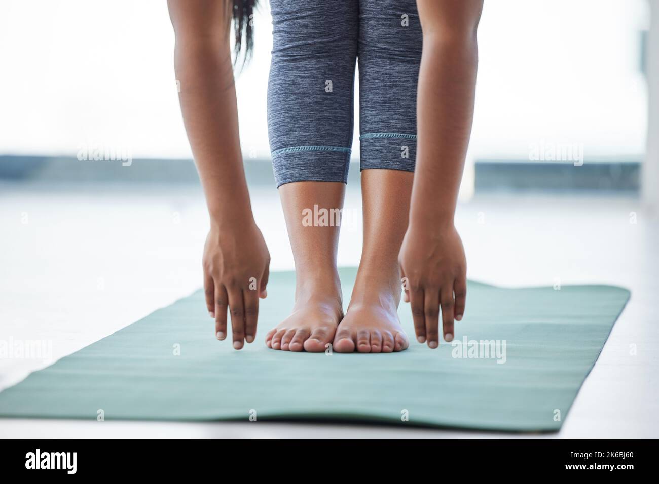 Woman floor stretches touching toes hi-res stock photography and images ...