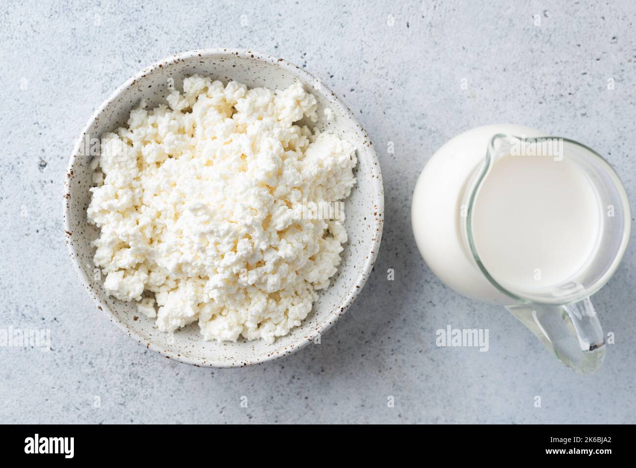 Cottage cheese, farmers cheese and jar of cow's milk. Dairy products ...
