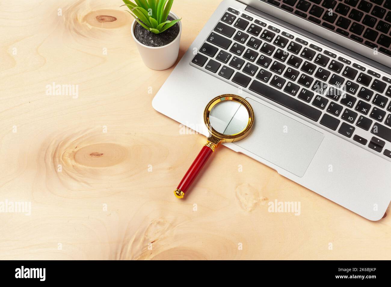 Laptop computer keyboard with magnifying glass, concept of search Stock ...