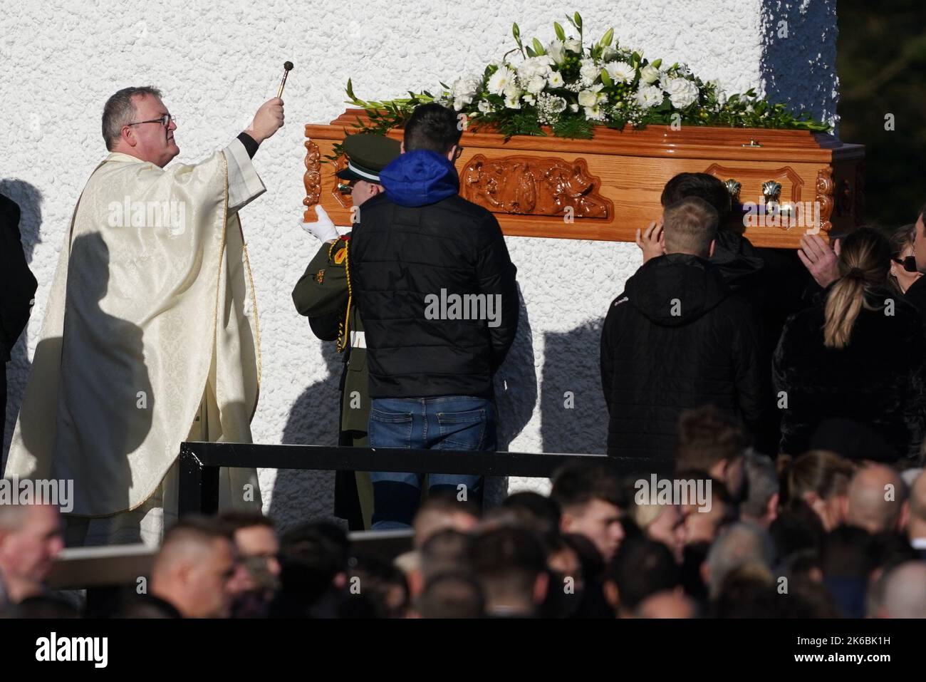 Father John Joe Duffy blesses the coffin of Martina Martin as it ...