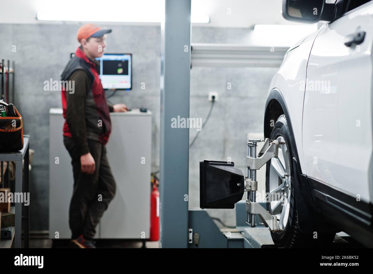Auto mechanic sets american SUV car for diagnostics and configuration ...