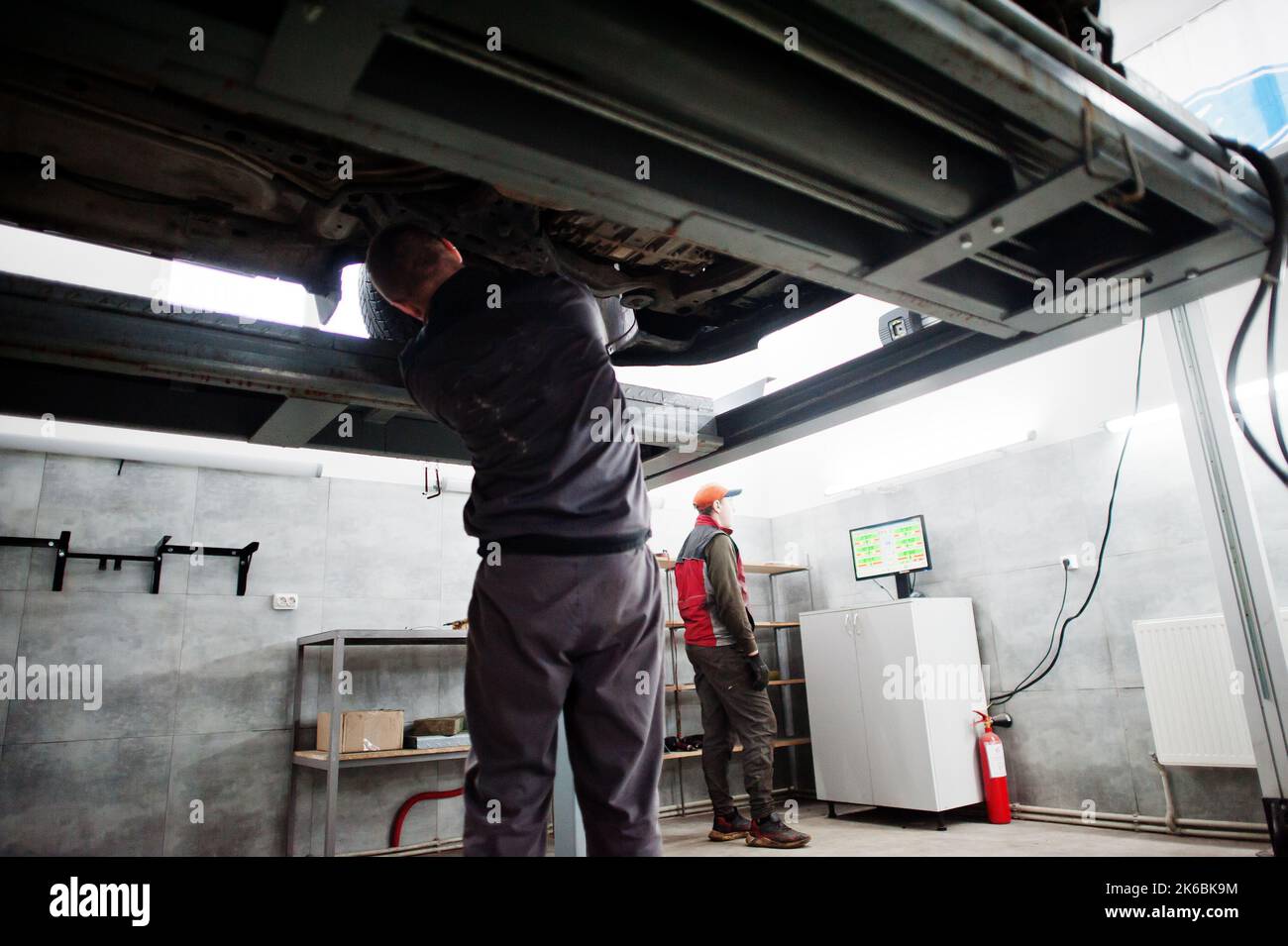 Auto mechanic sets american SUV car for diagnostics and configuration ...