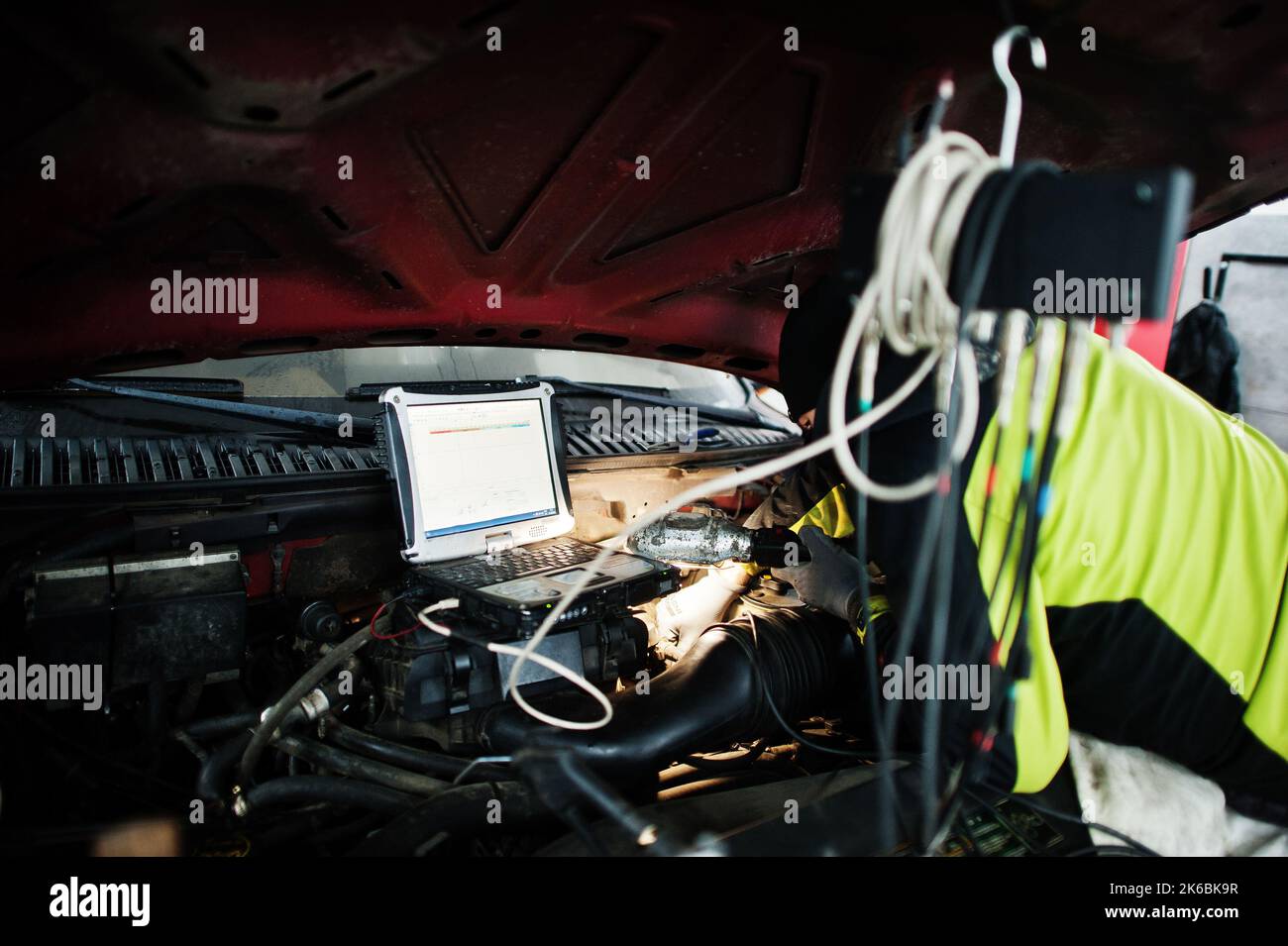 Auto mechanic sets american SUV car for diagnostics and configuration ...