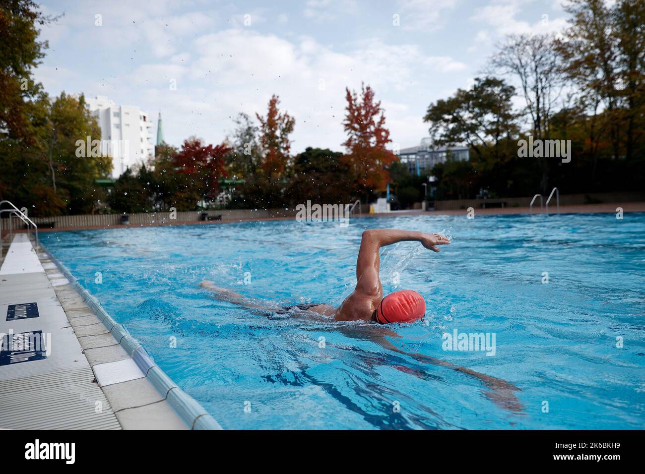 Berlin, Germany. 13th Oct, 2022. A bather swims laps in a pool at ...