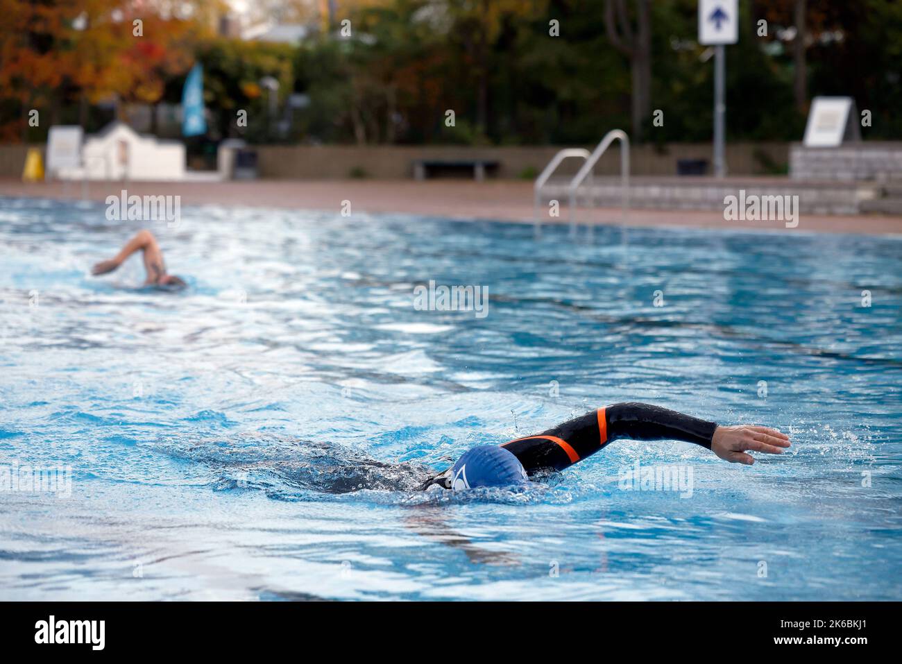 Berlin, Germany. 13th Oct, 2022. Bathers swim laps in a pool at ...