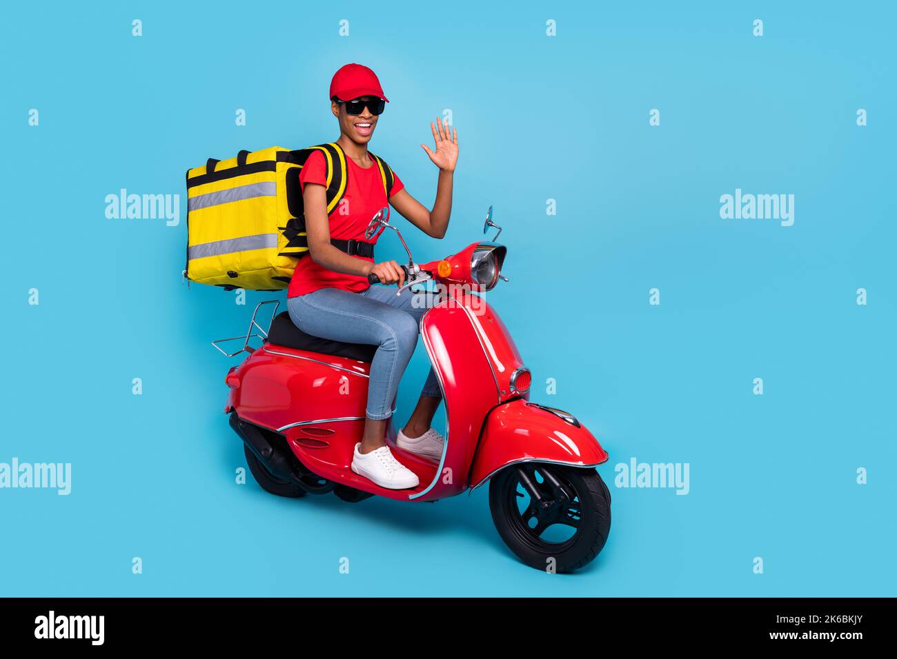 Photo of friendly funky short hair human wear red uniform moped rider ...