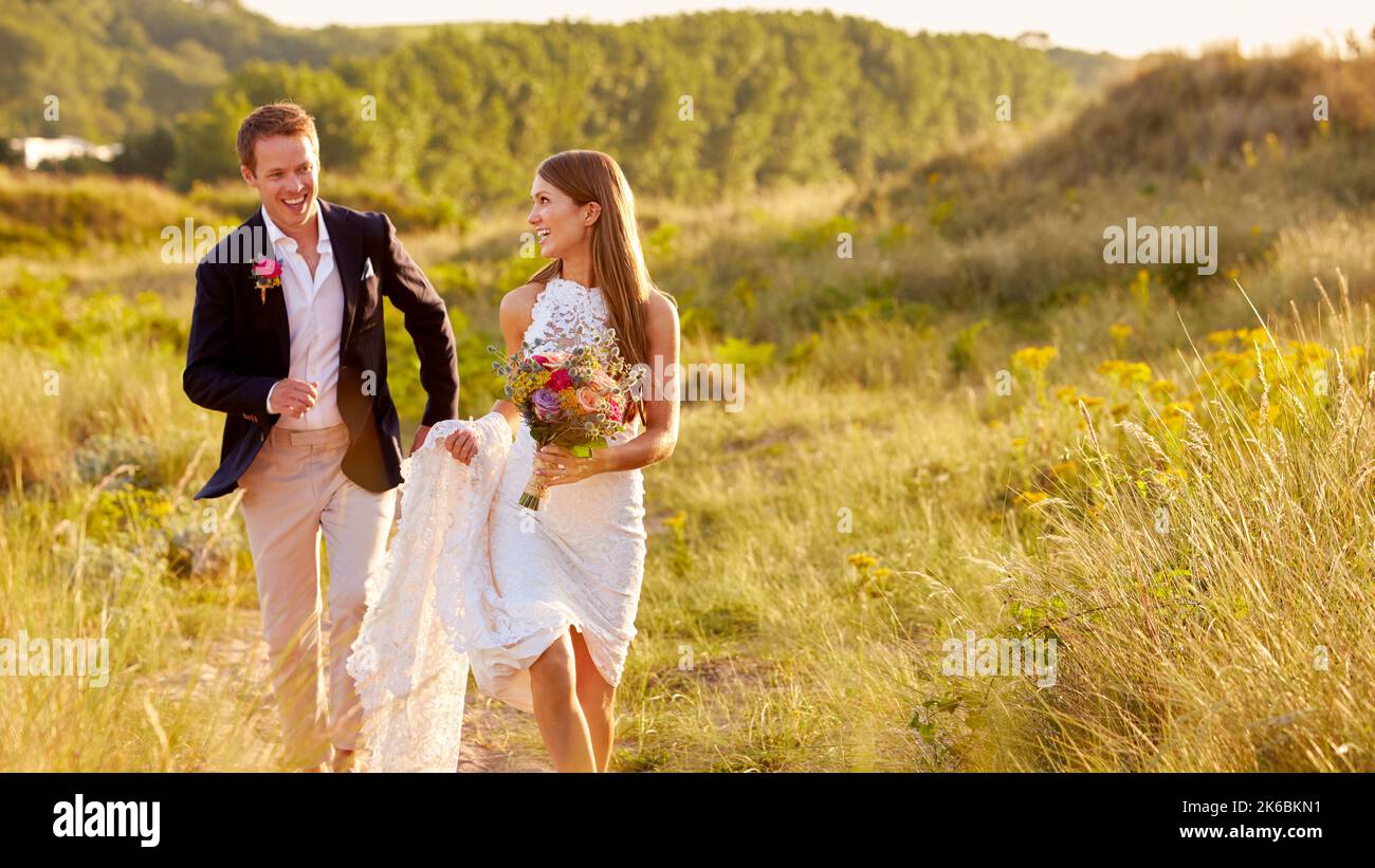 Romantic couple running together in hi-res stock photography and images ...