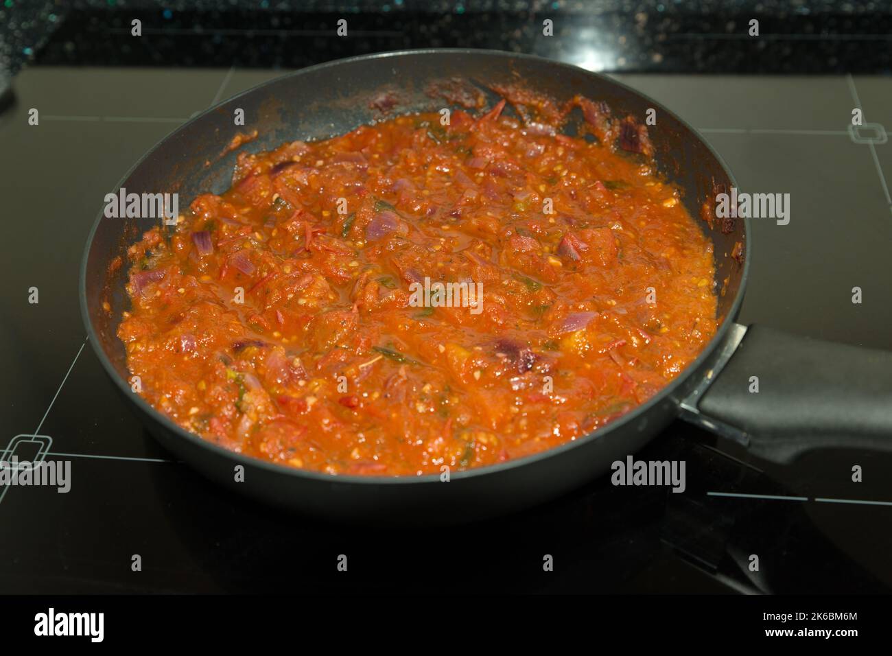 close up image cooking frying pan filled with chilli con carne. The hot ...