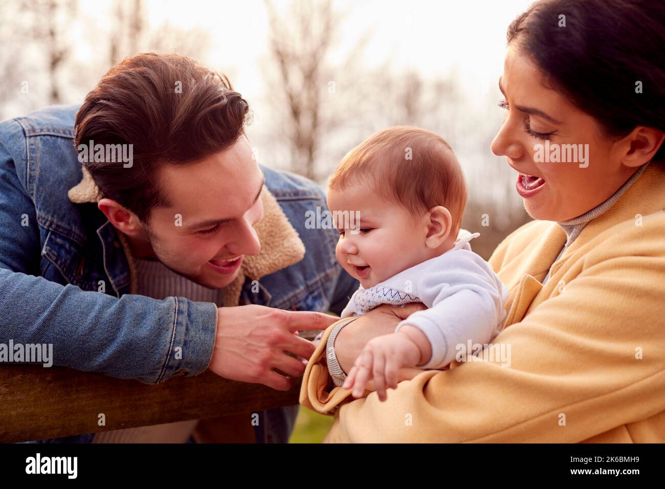 Transgender Family With Baby Enjoying Walk In Autumn Or Winter ...