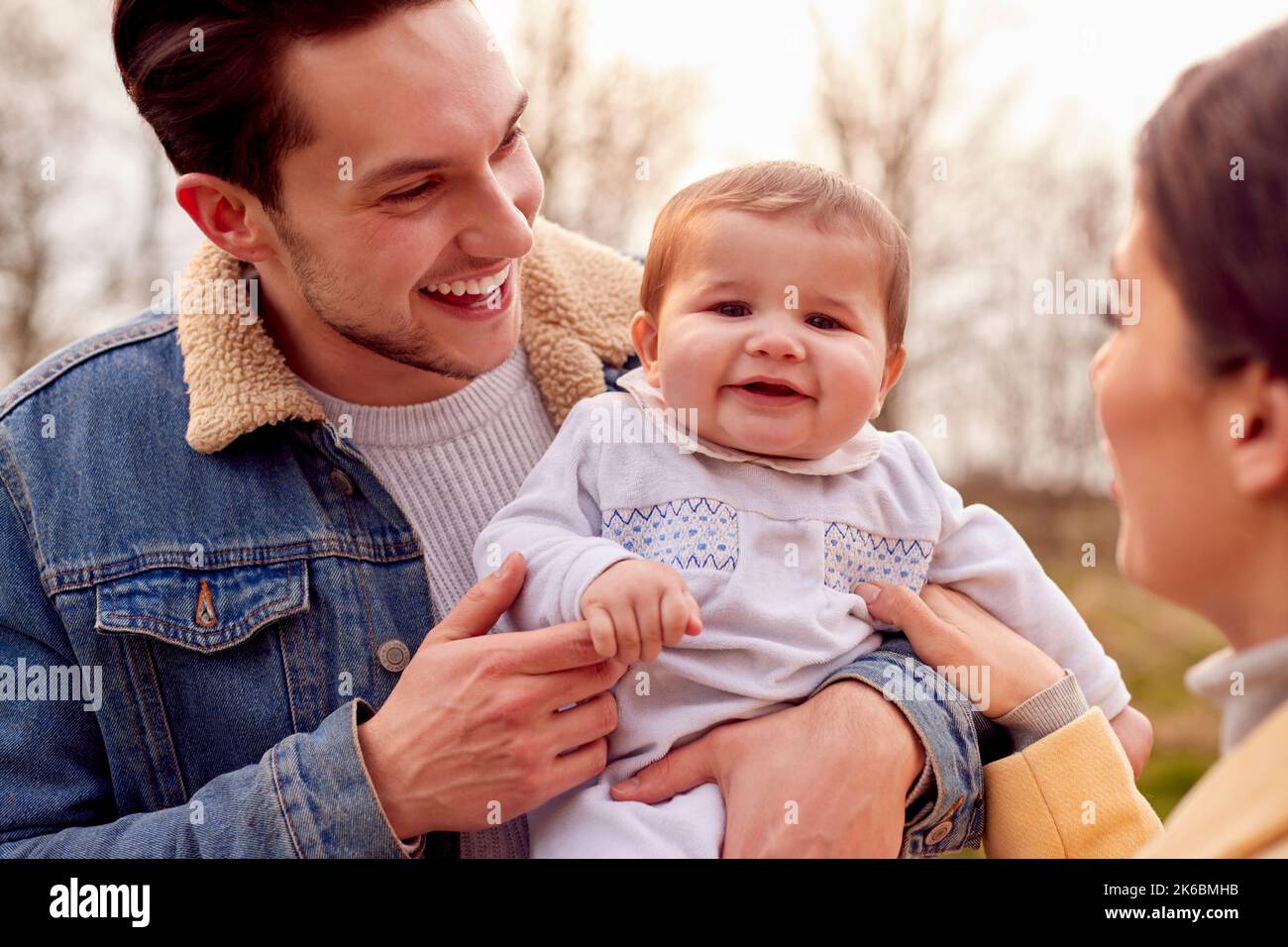 Transgender Family With Baby Enjoying Walk In Autumn Or Winter ...
