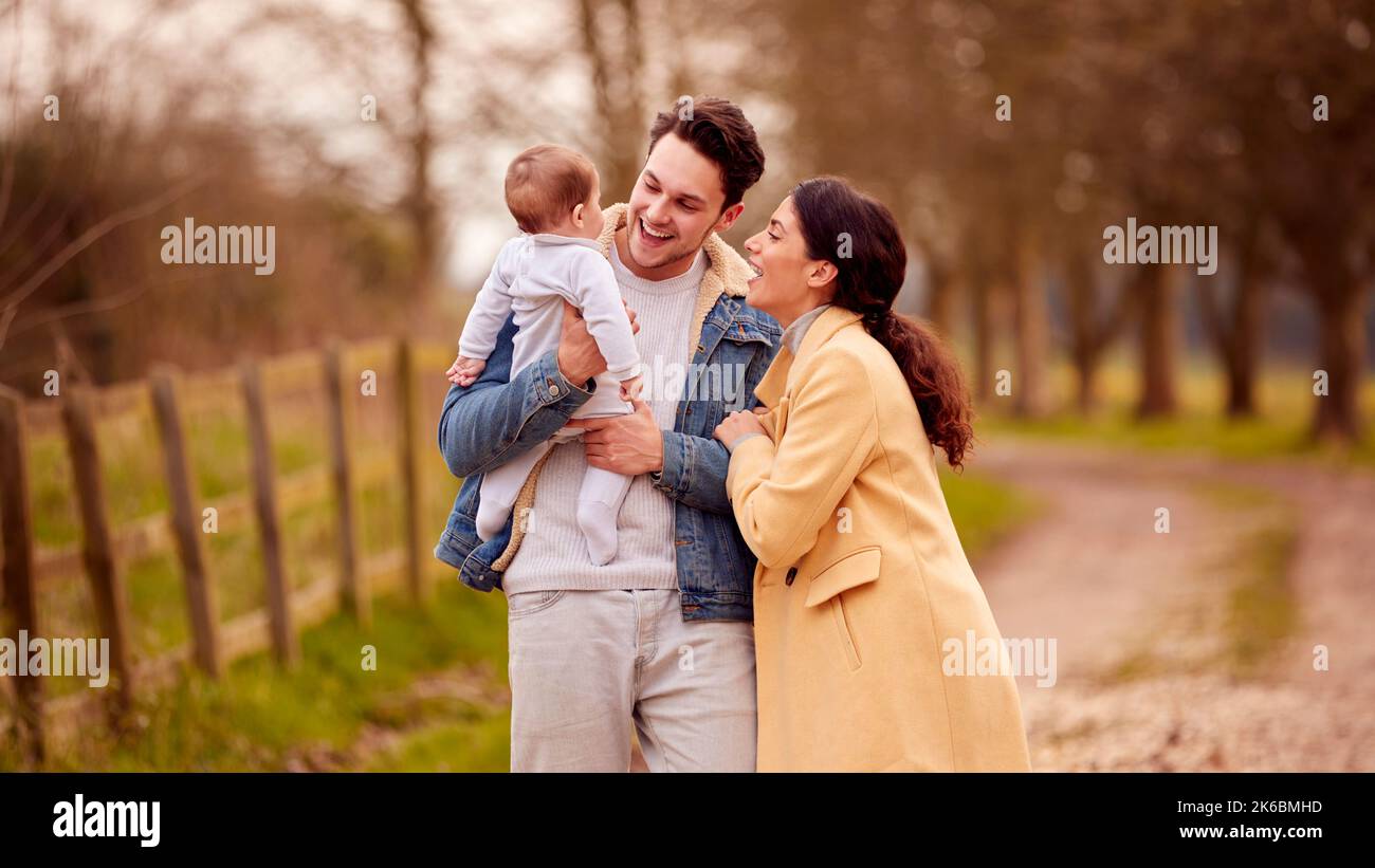 Transgender Family With Baby Enjoying Walk In Autumn Or Winter ...