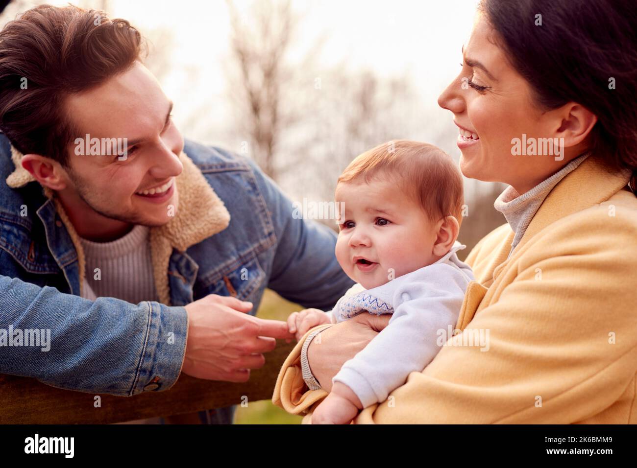 Transgender Family With Baby Enjoying Walk In Autumn Or Winter ...
