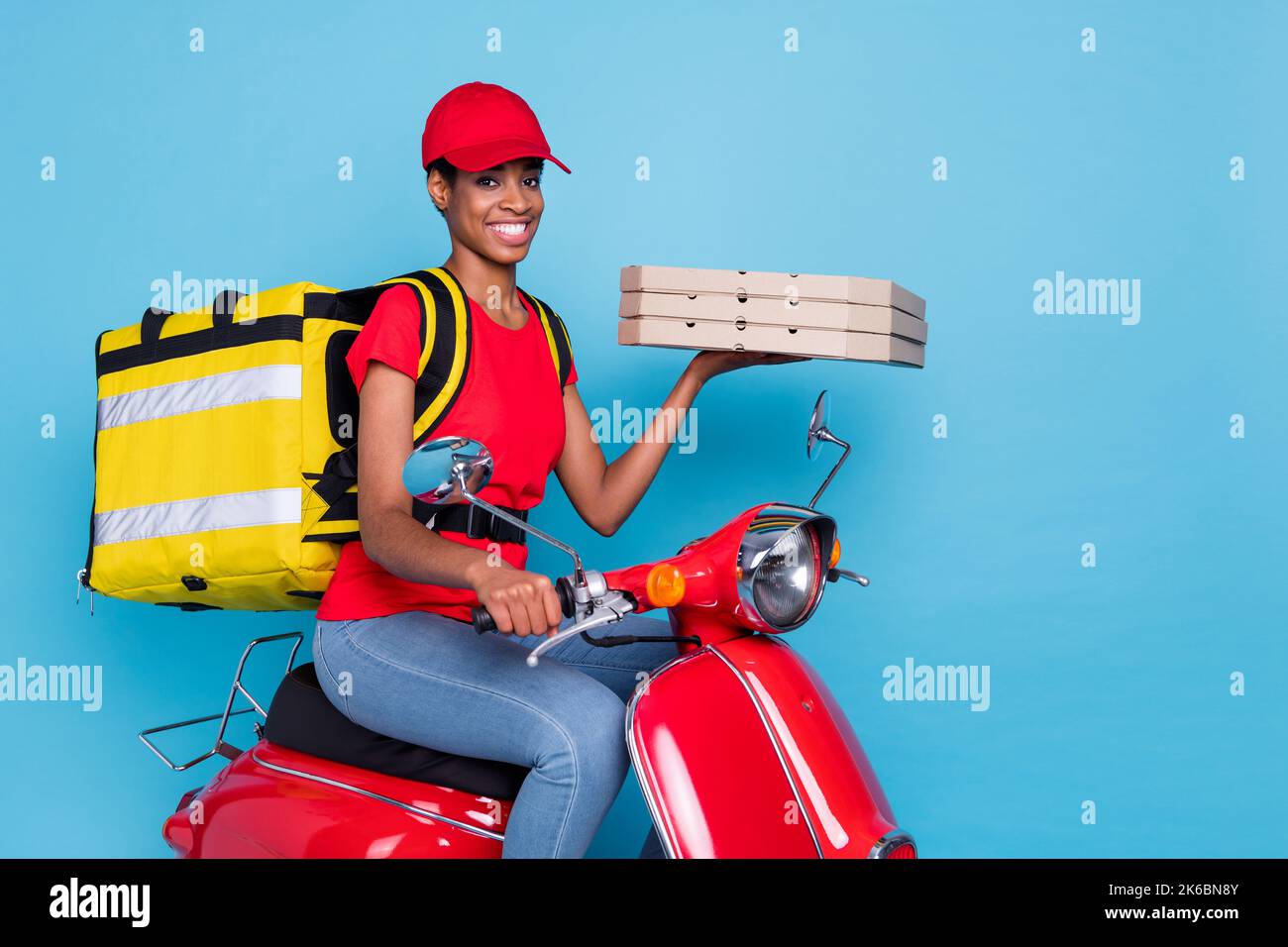 Photo of pretty funny short hair human wear red uniform moped rider ...